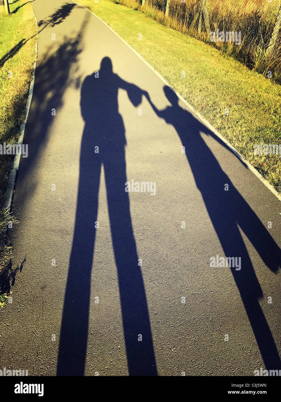 Mother and child. Off to school with a hop, skip and a jump! Stock ...