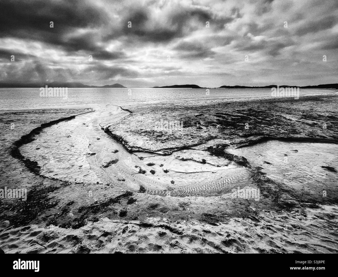A stream entering the sea at BallinSkellig beach, BallinSkellig Bay ...