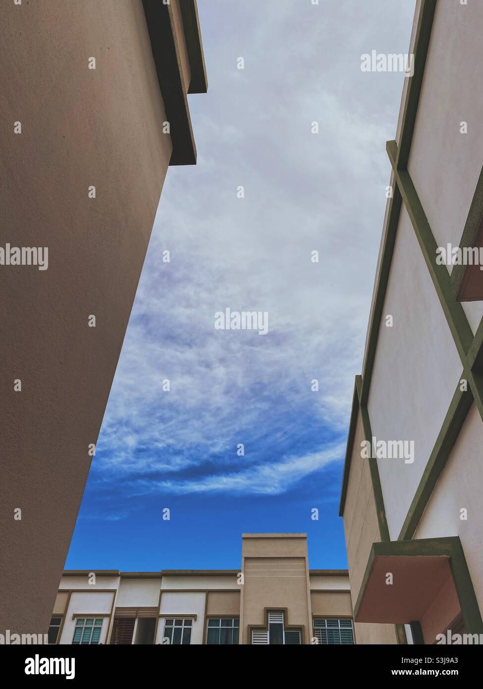 Life in between buildings Stock Photo - Alamy