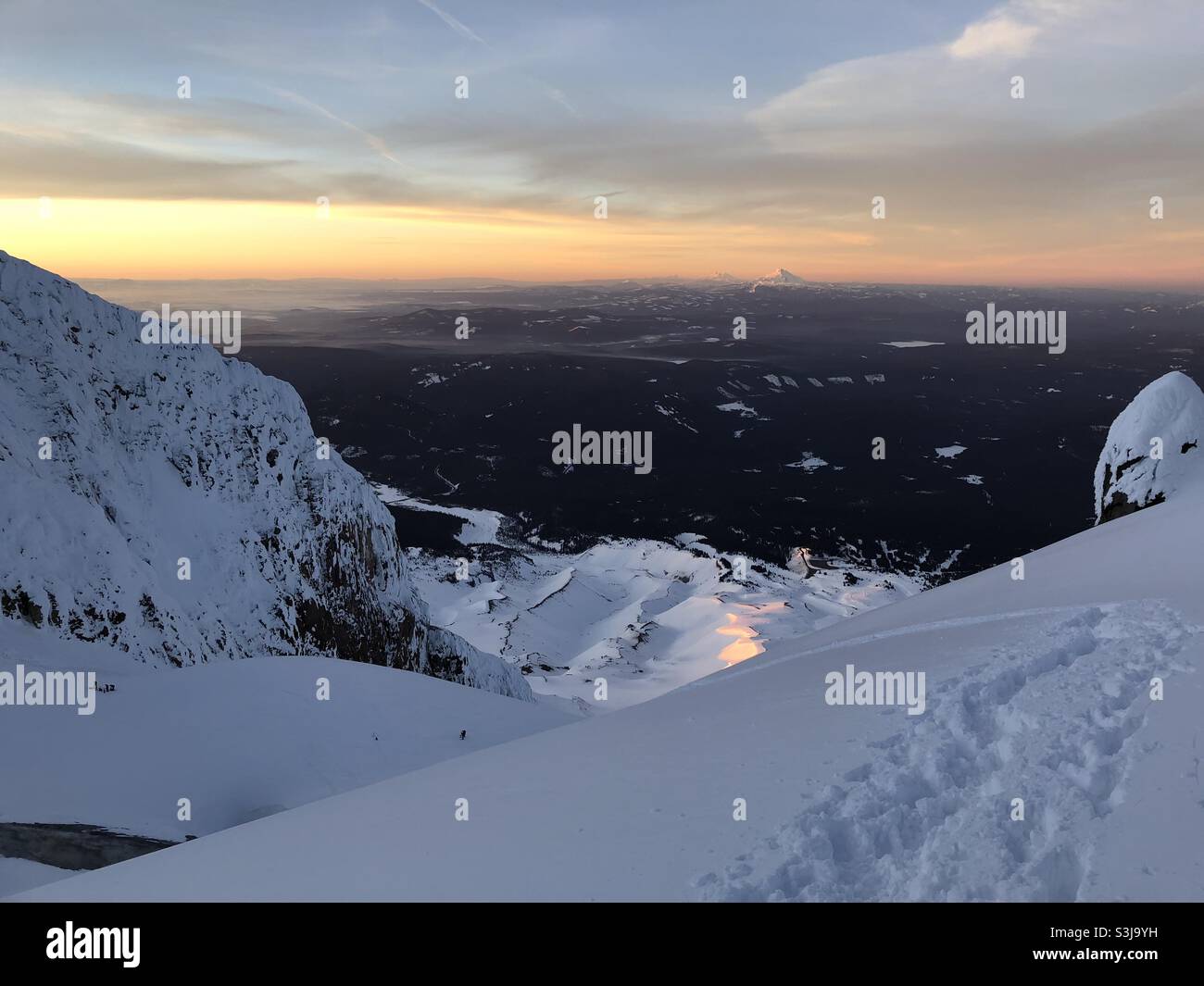 A sunrise from the Hogsback on Mount Hood, Oregon. Mount Jefferson in ...