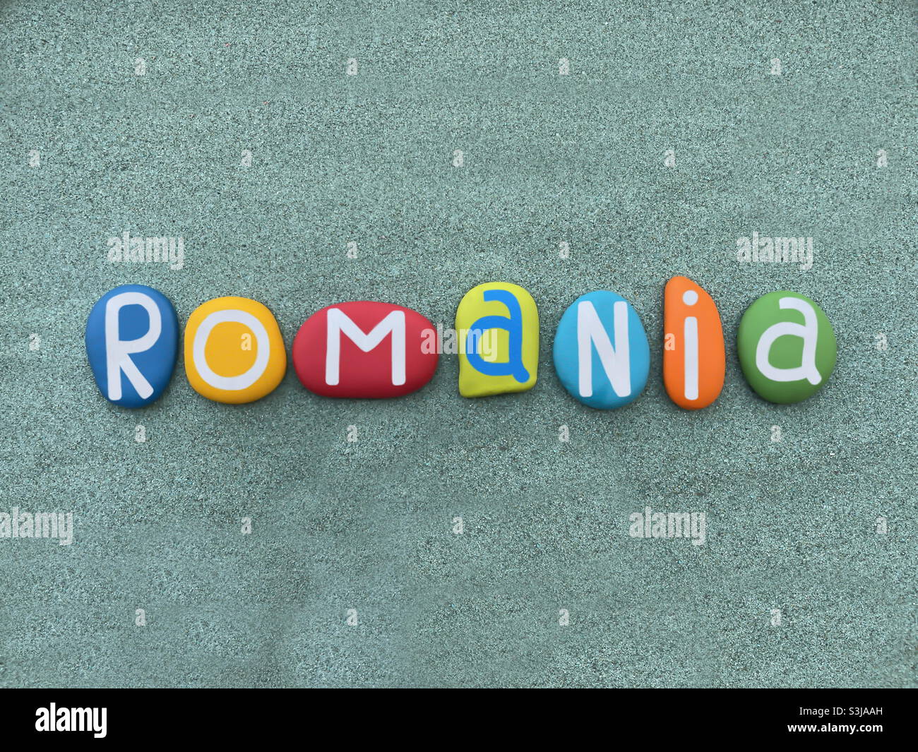 Romania, country name composed with mylti colored stone letters over ...