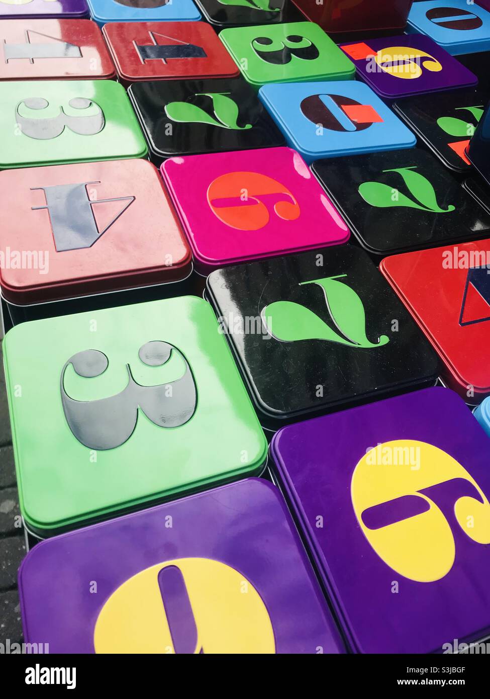 Numbers on a colorful metal cans Stock Photo - Alamy