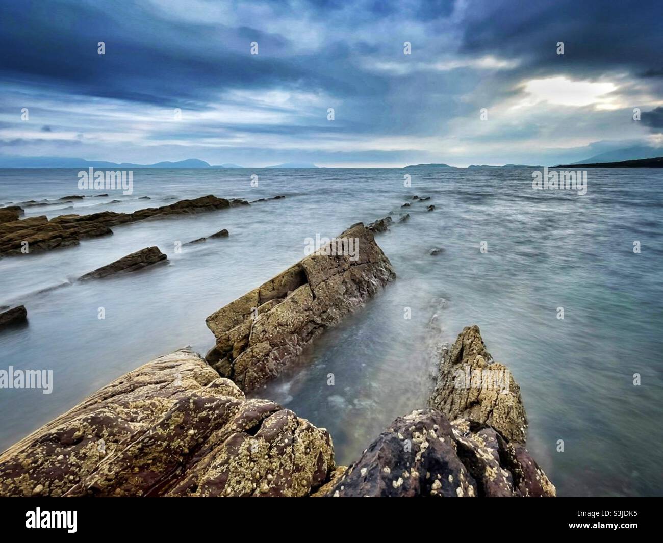 Rocks entering the sea on the south west coast of Ireland at ...