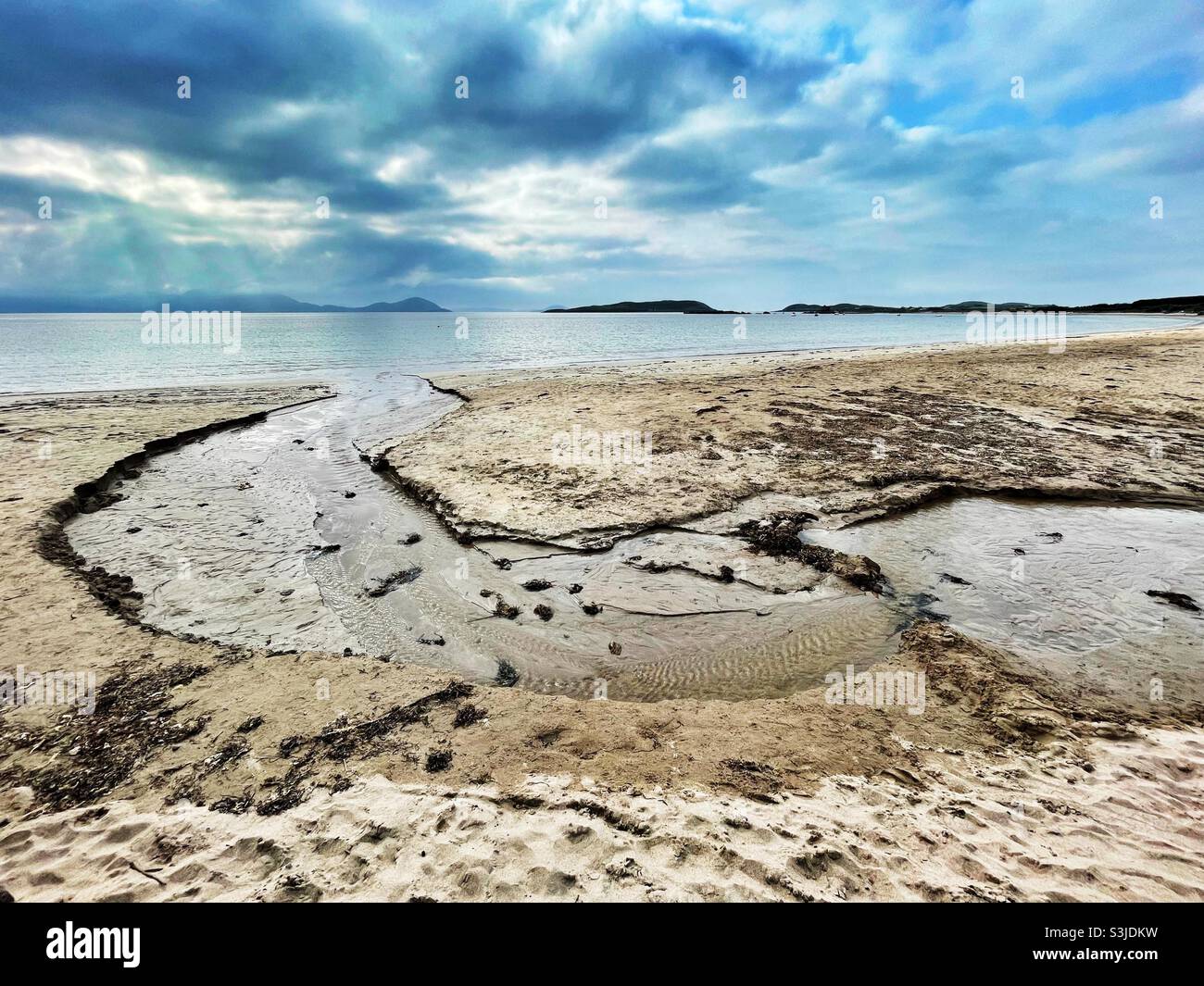 Stream entering the sea on BallinSkelligs bay, County Kerry, Ireland ...