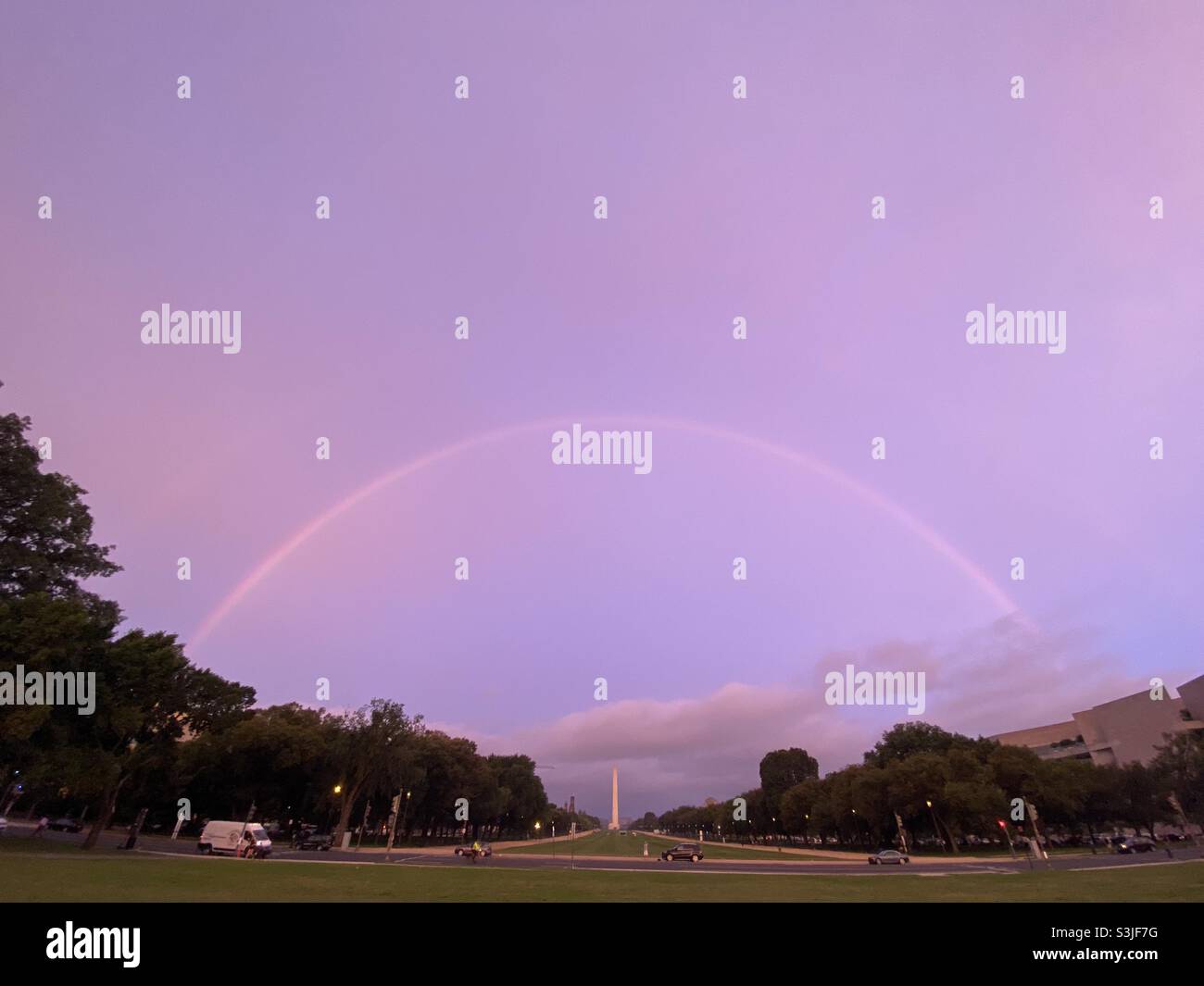 A rainbow arcs above the National Mall as the sun rises in Washington ...