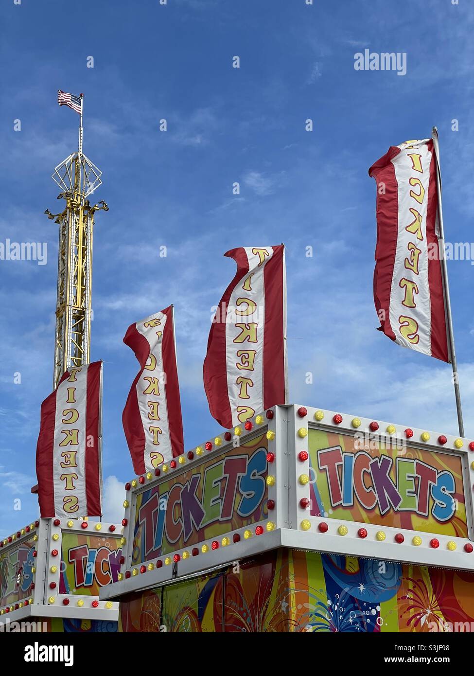 Ticket booth flags at an outdoor festival Stock Photo - Alamy