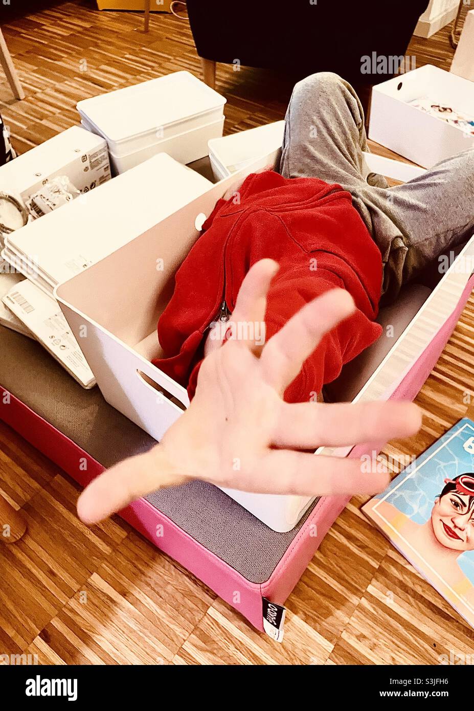 Little boy playing in a box Stock Photo - Alamy
