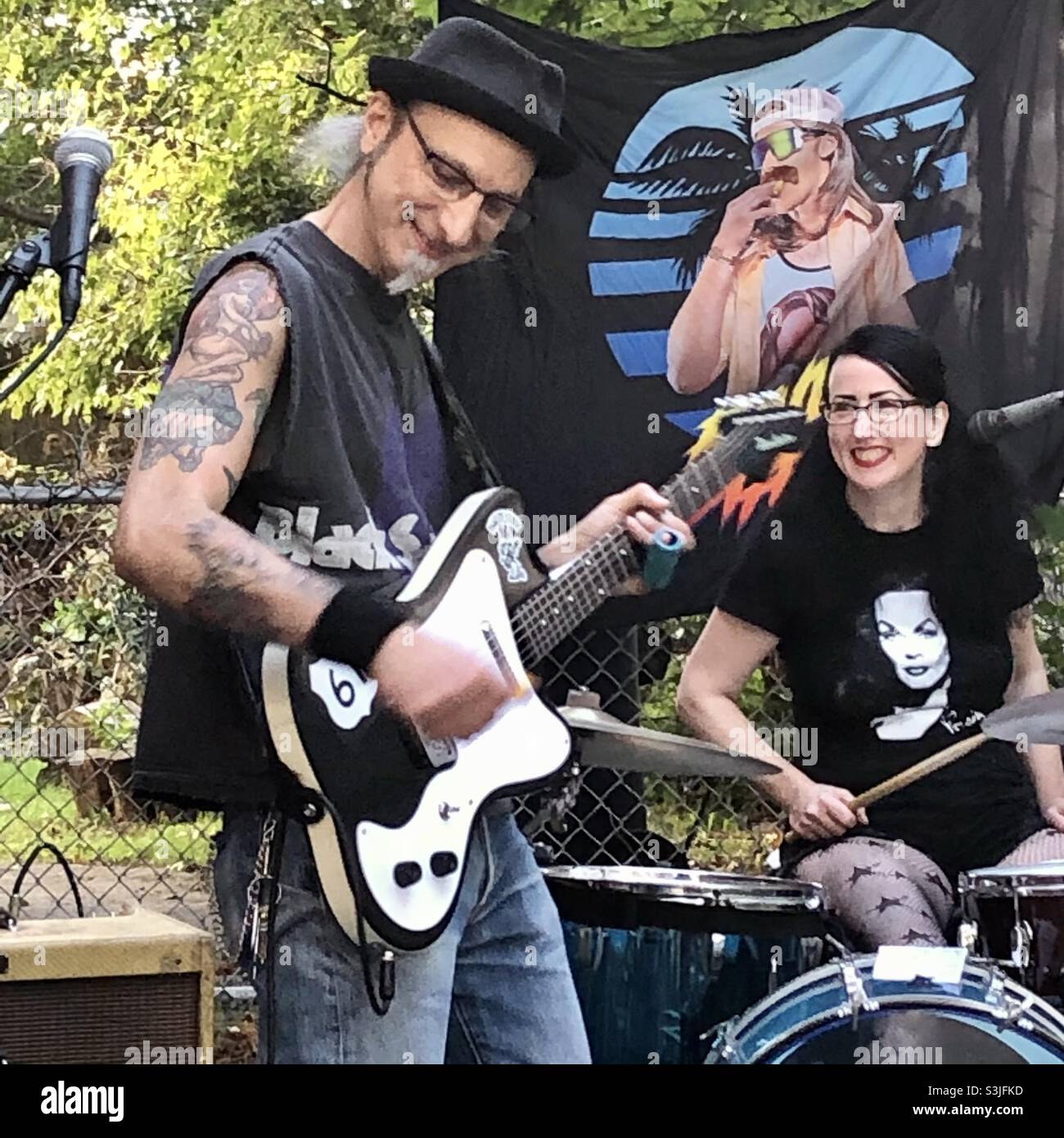 Band playing at neighborhood concert outside driveway during pandemic ...
