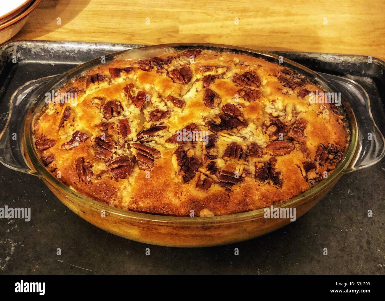 Sticky toffee apple pudding with pecans Stock Photo - Alamy