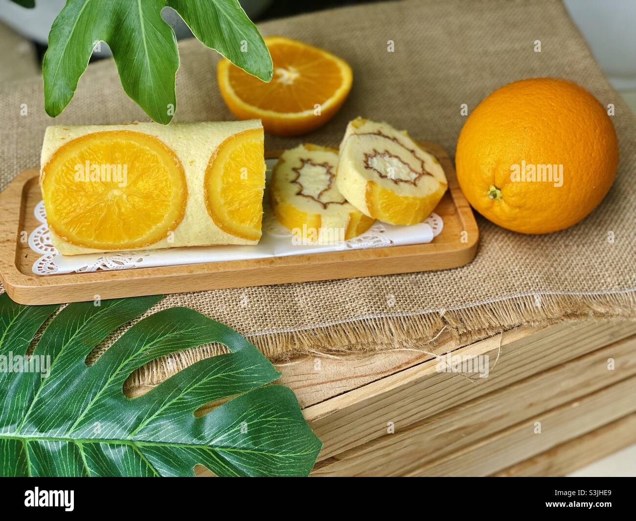 Orange roll cake Stock Photo - Alamy