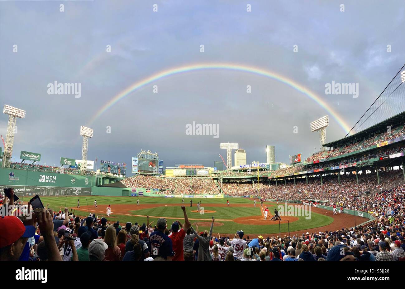 Somewhere over a rainbow we play baseball! During a cloudy day in ...