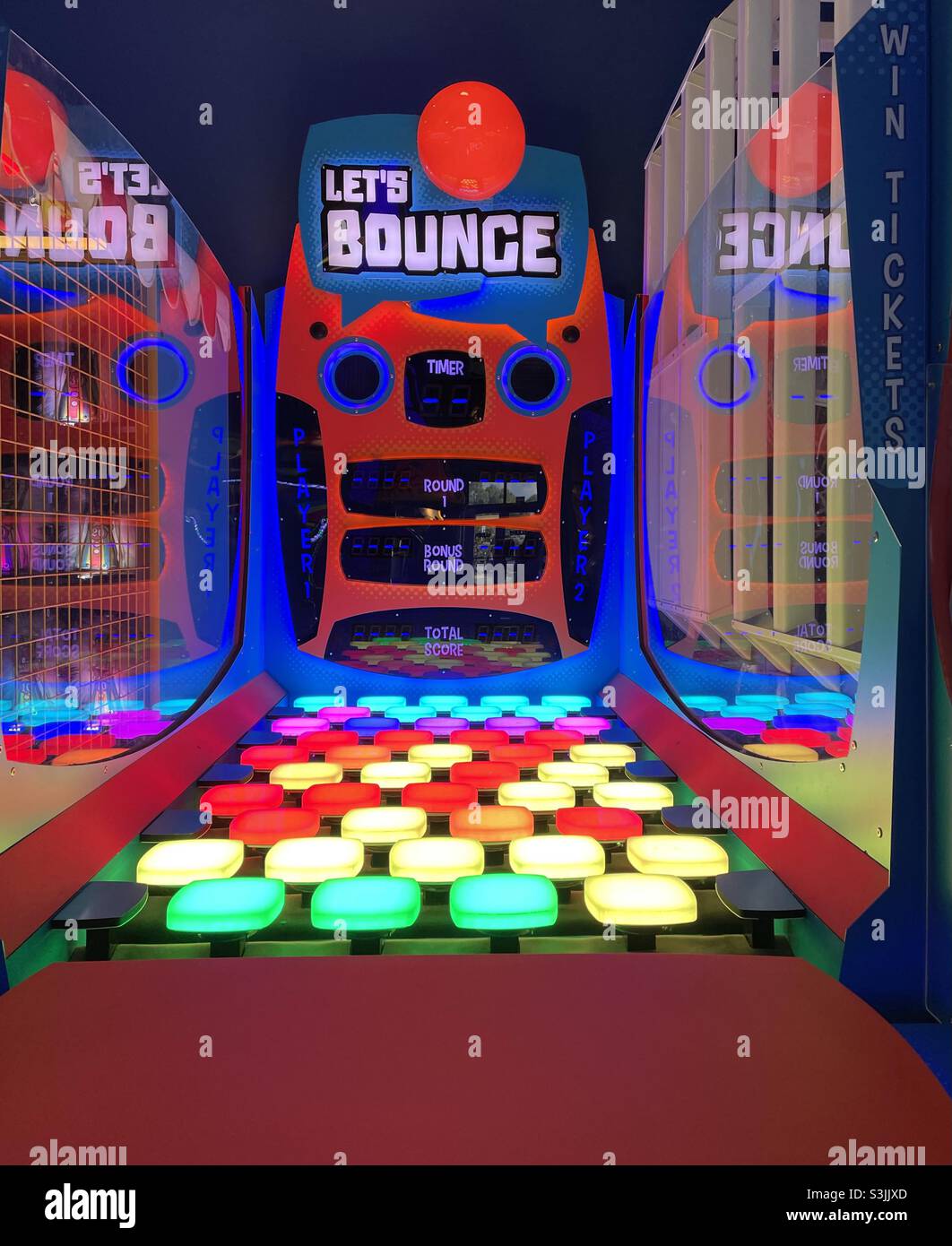 Colorful neon light arcade game Stock Photo - Alamy