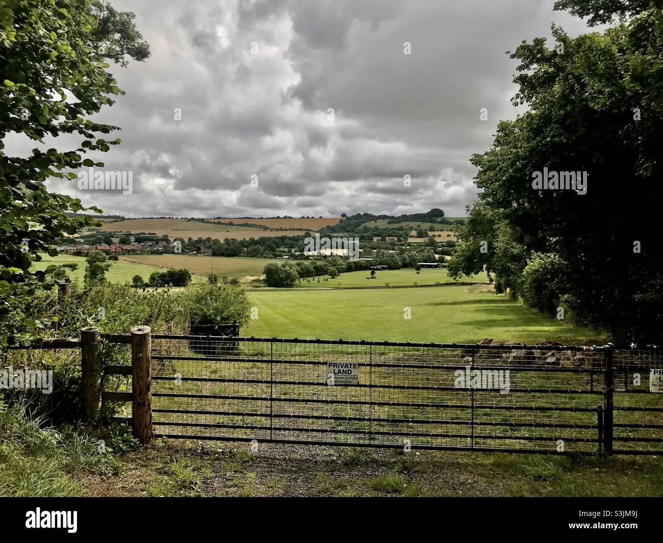 Leaden skies over Ogbourne St George from The Ridgeway Stock Photo - Alamy
