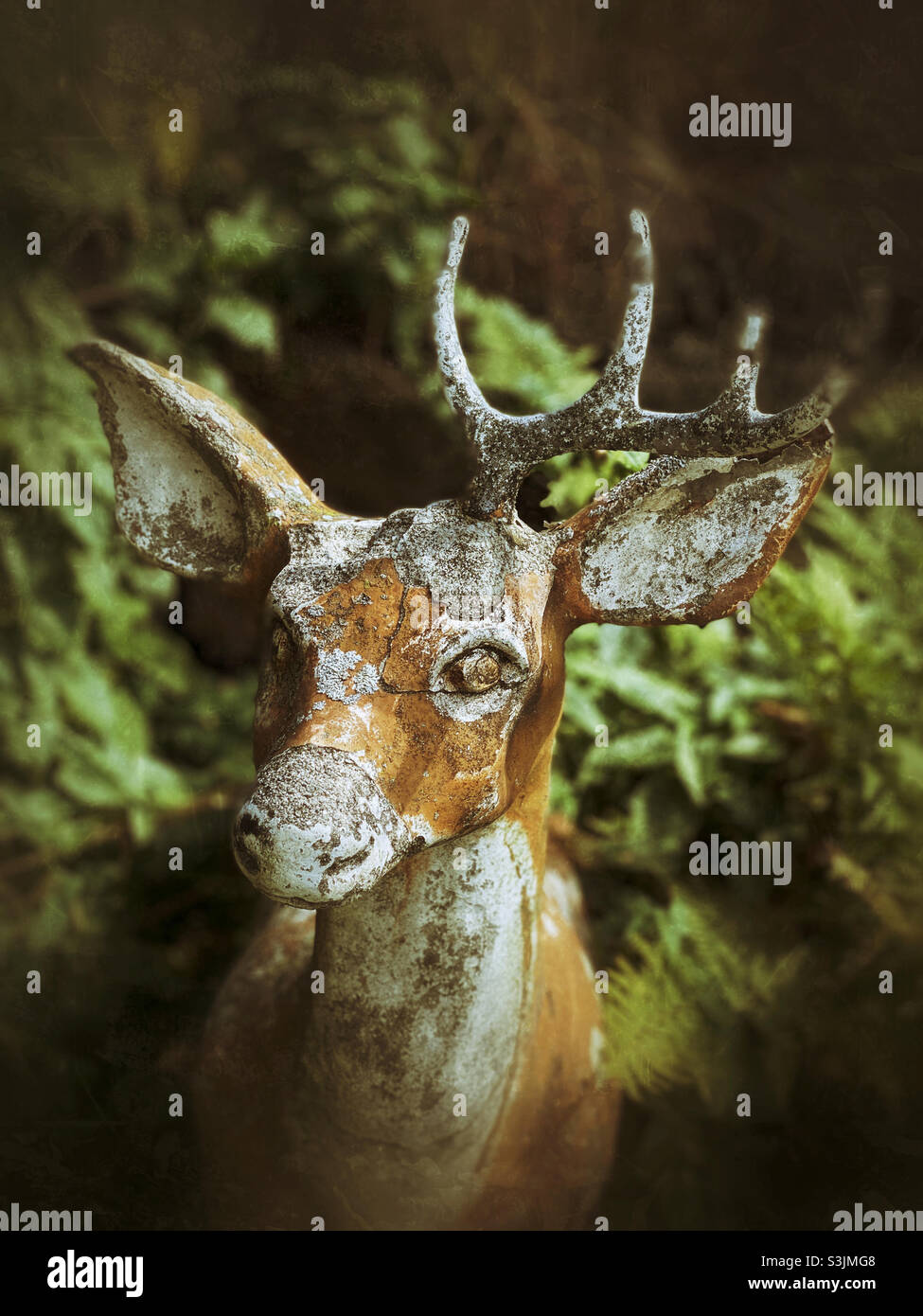 Decrepit and spooky deer statue in woods Stock Photo - Alamy
