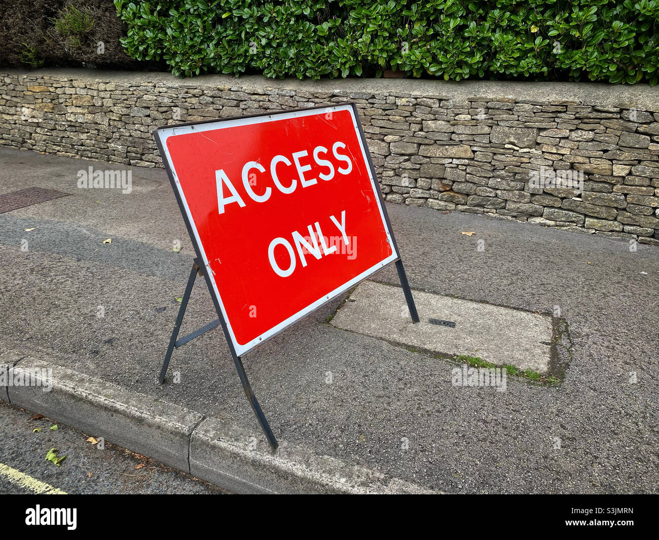 ACCESS ONLY. Roadworks sign indicating works ahead with limited access ...
