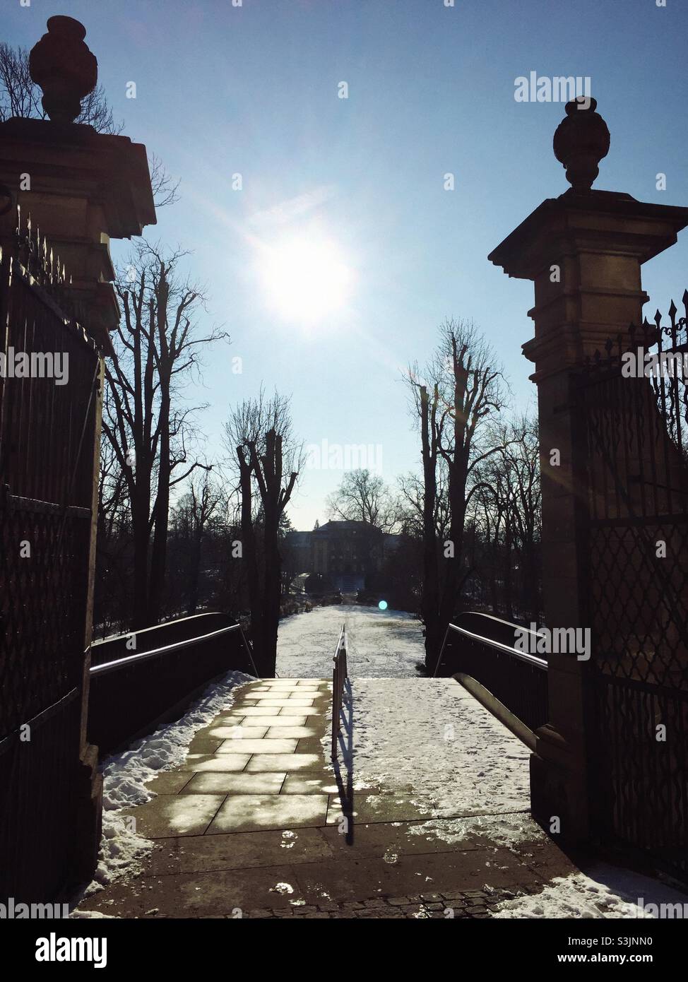 Open gate and stairs in backlight leading into a park Stock Photo - Alamy