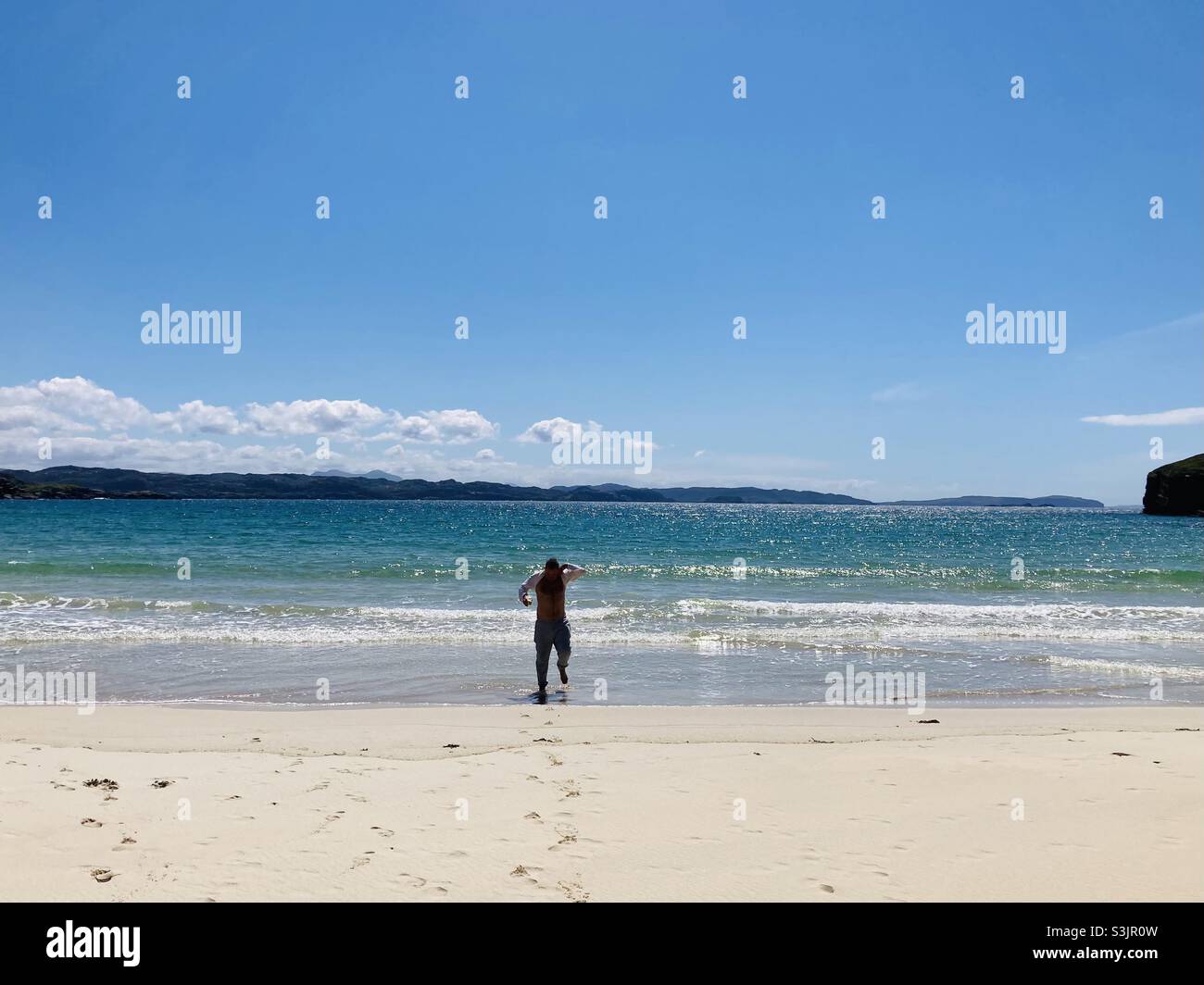 Going for a dip in the sea in Scotland Stock Photo - Alamy
