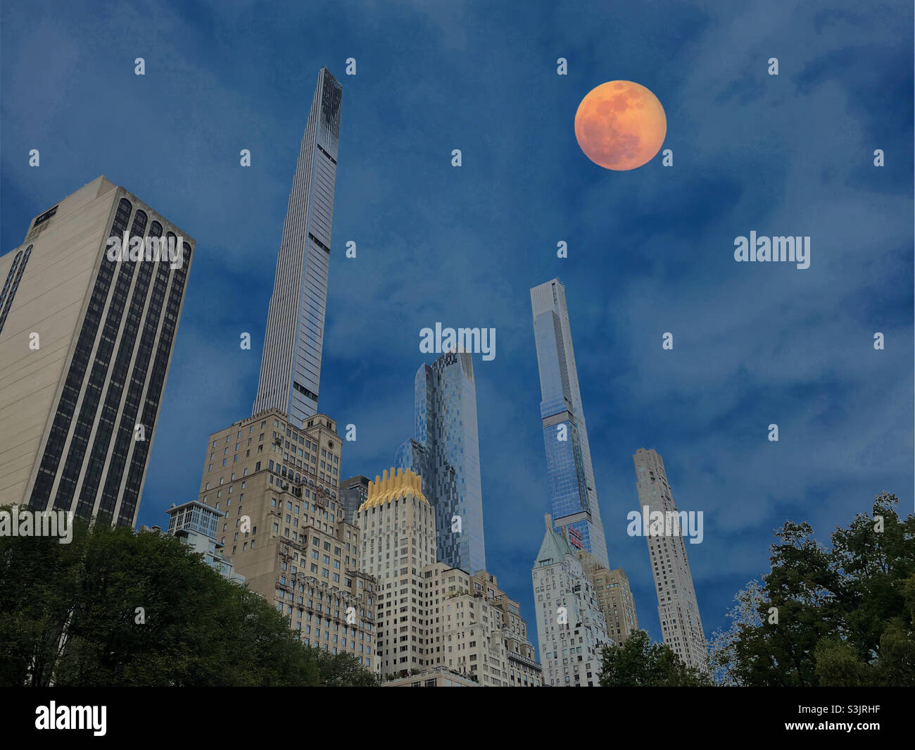 A full moon rising over super tall condominiums in midtown Manhattan on ...