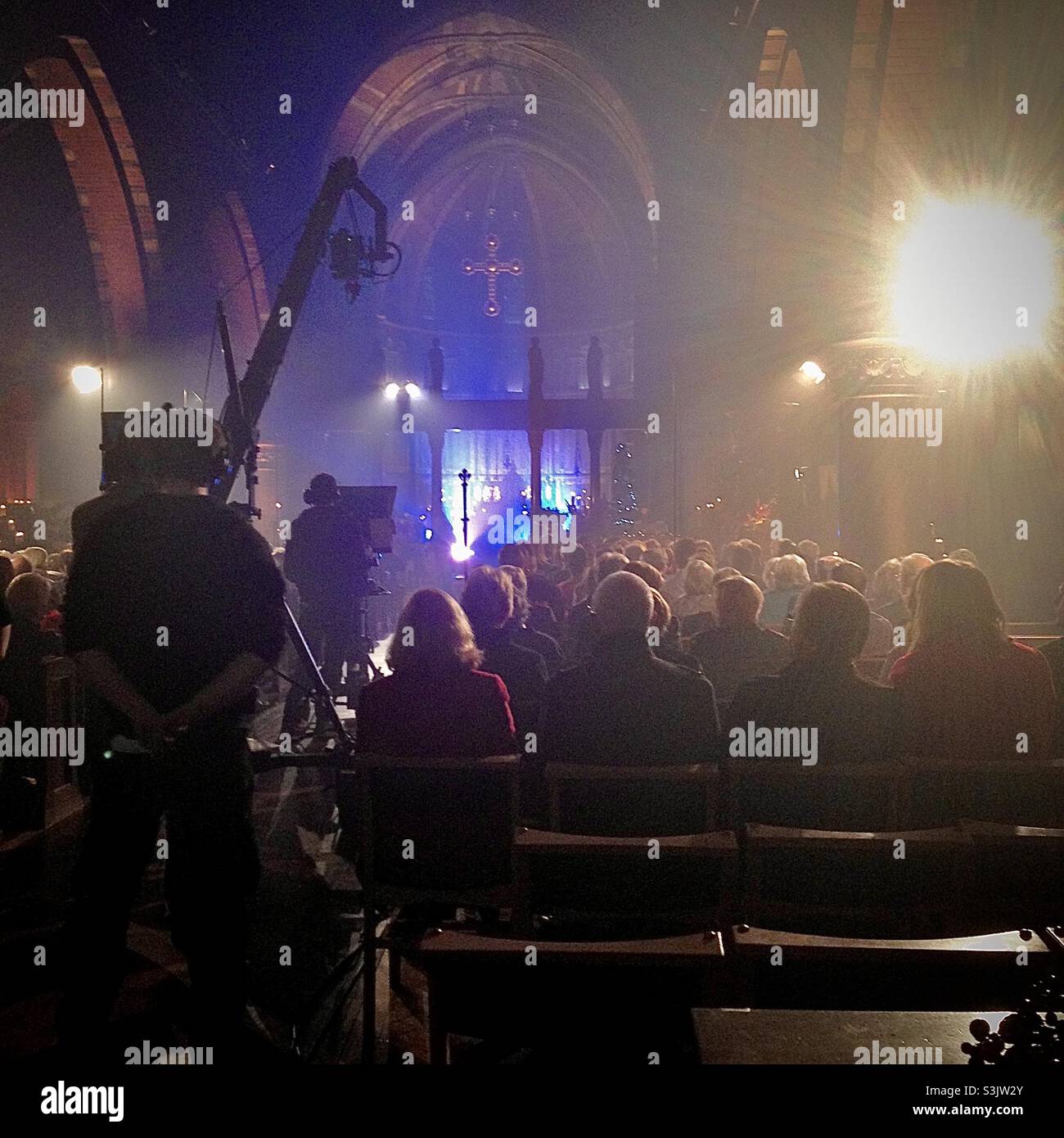 Filming TV show in church Stock Photo - Alamy