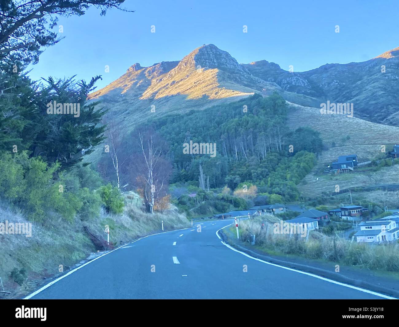 Driving through the Port Hills , Canterbury, New Zealand Stock Photo ...