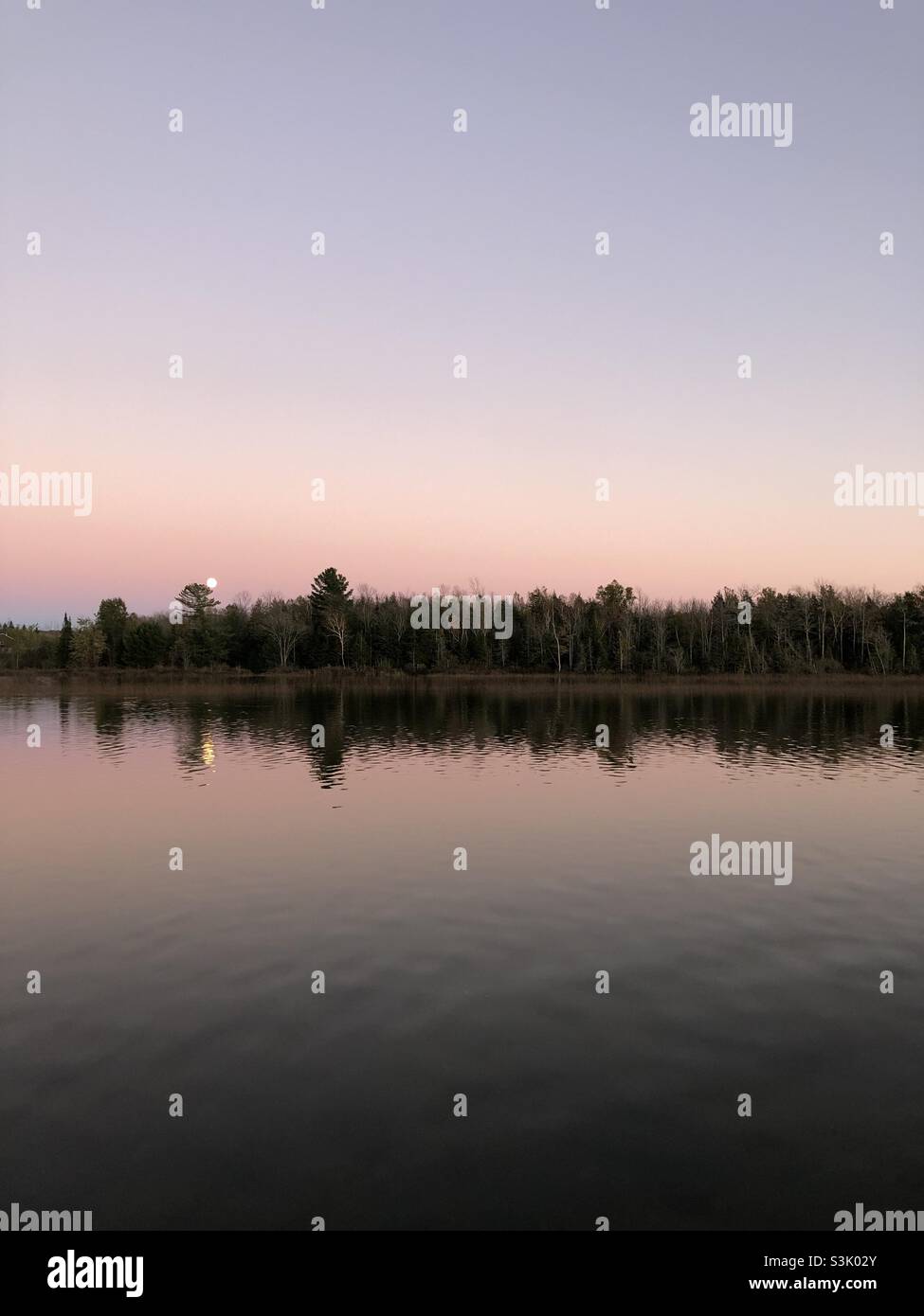 Moonrise over lake Stock Photo - Alamy