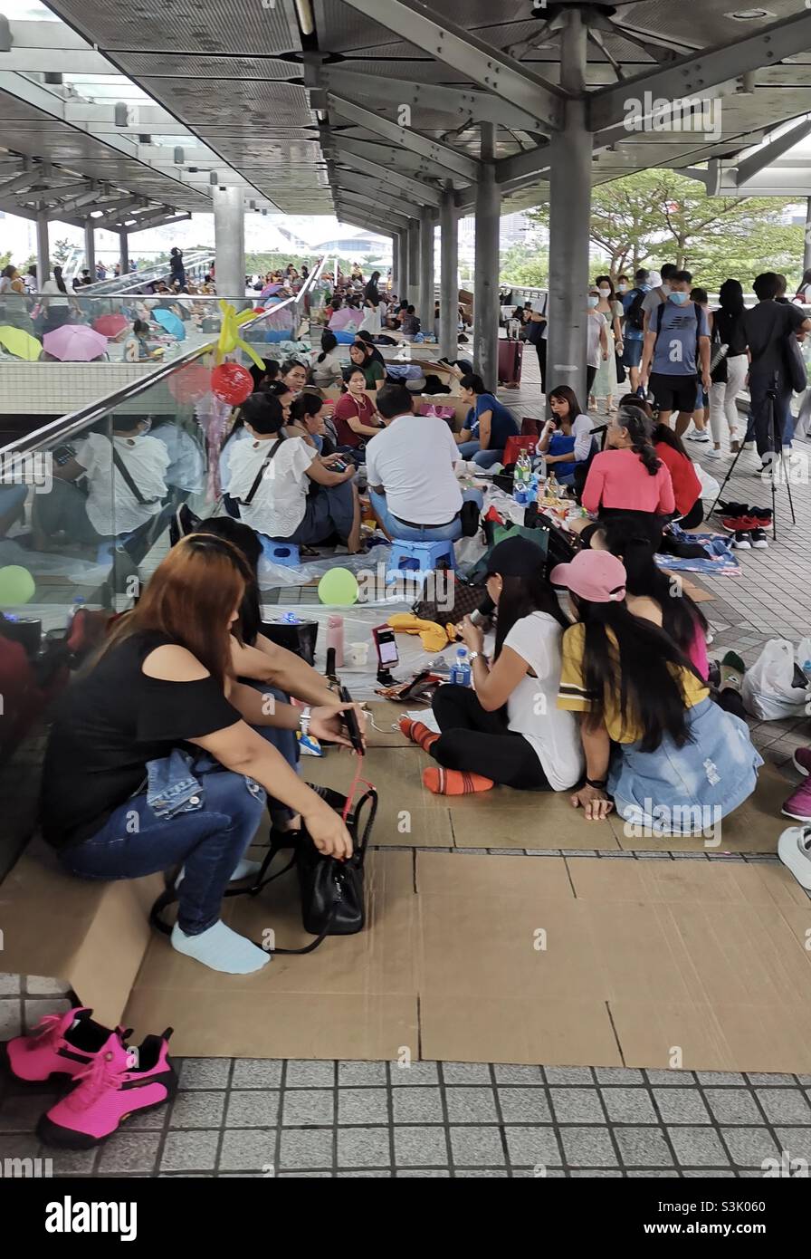 Domestic helpers on their day off in Central district in Hong Kong ...