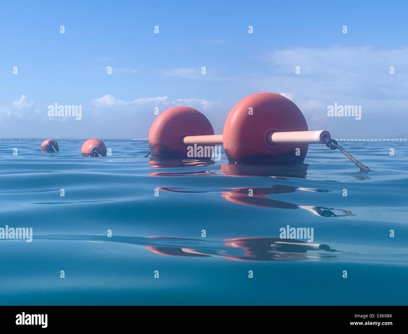 Floating barbell buoy at Athens beach Stock Photo - Alamy