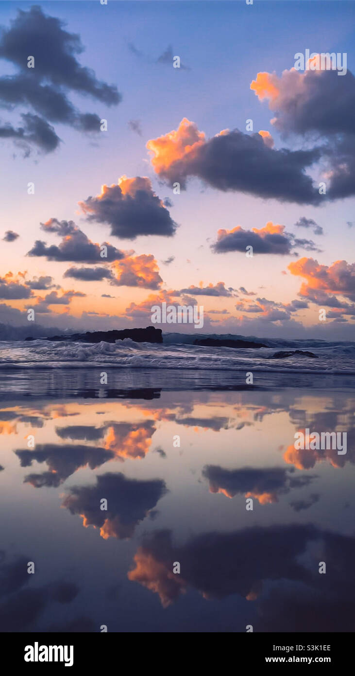 Sky reflection on the beach Stock Photo - Alamy