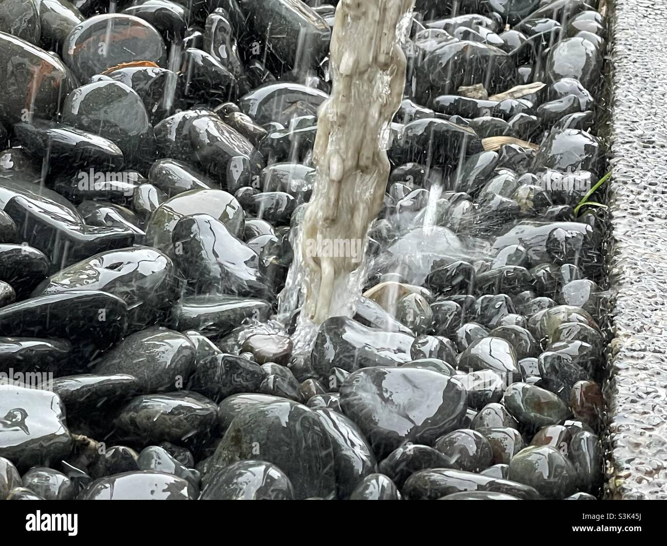 Running water onto pebbles hi-res stock photography and images - Alamy