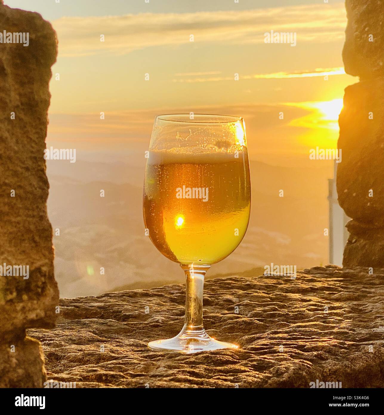Evening cocktail at sunset. On the historic castle walls of San Marino ...