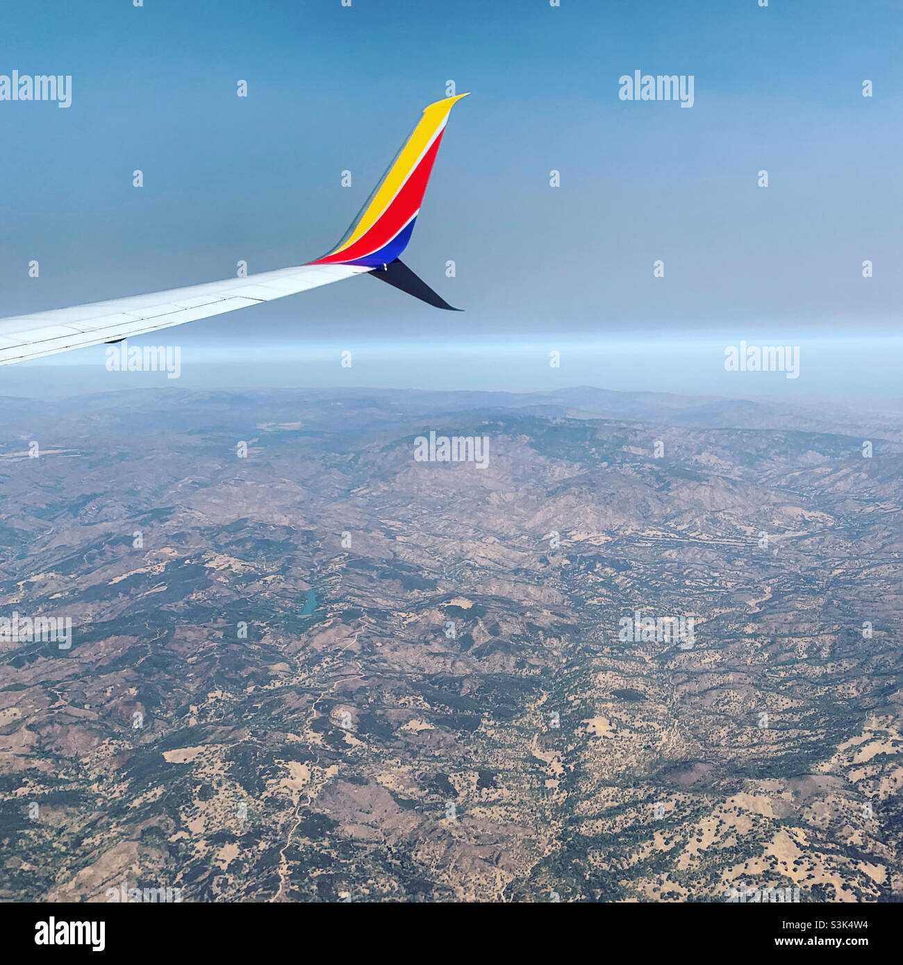 Southwest Air wing over the landscape while descending towards San Jose ...