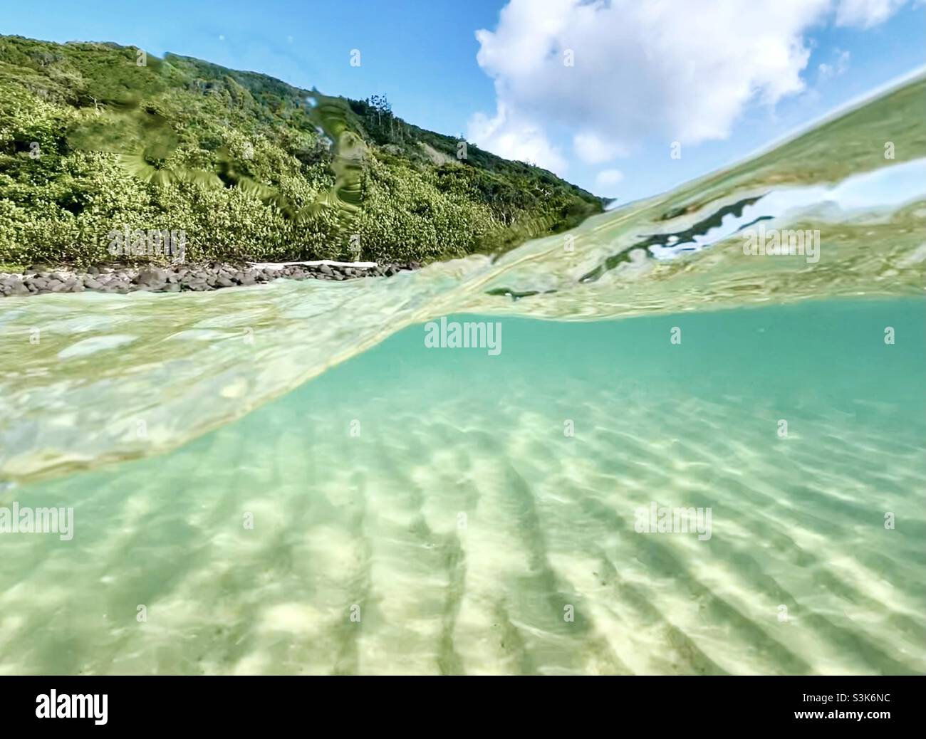Half waves half sand hi-res stock photography and images - Alamy