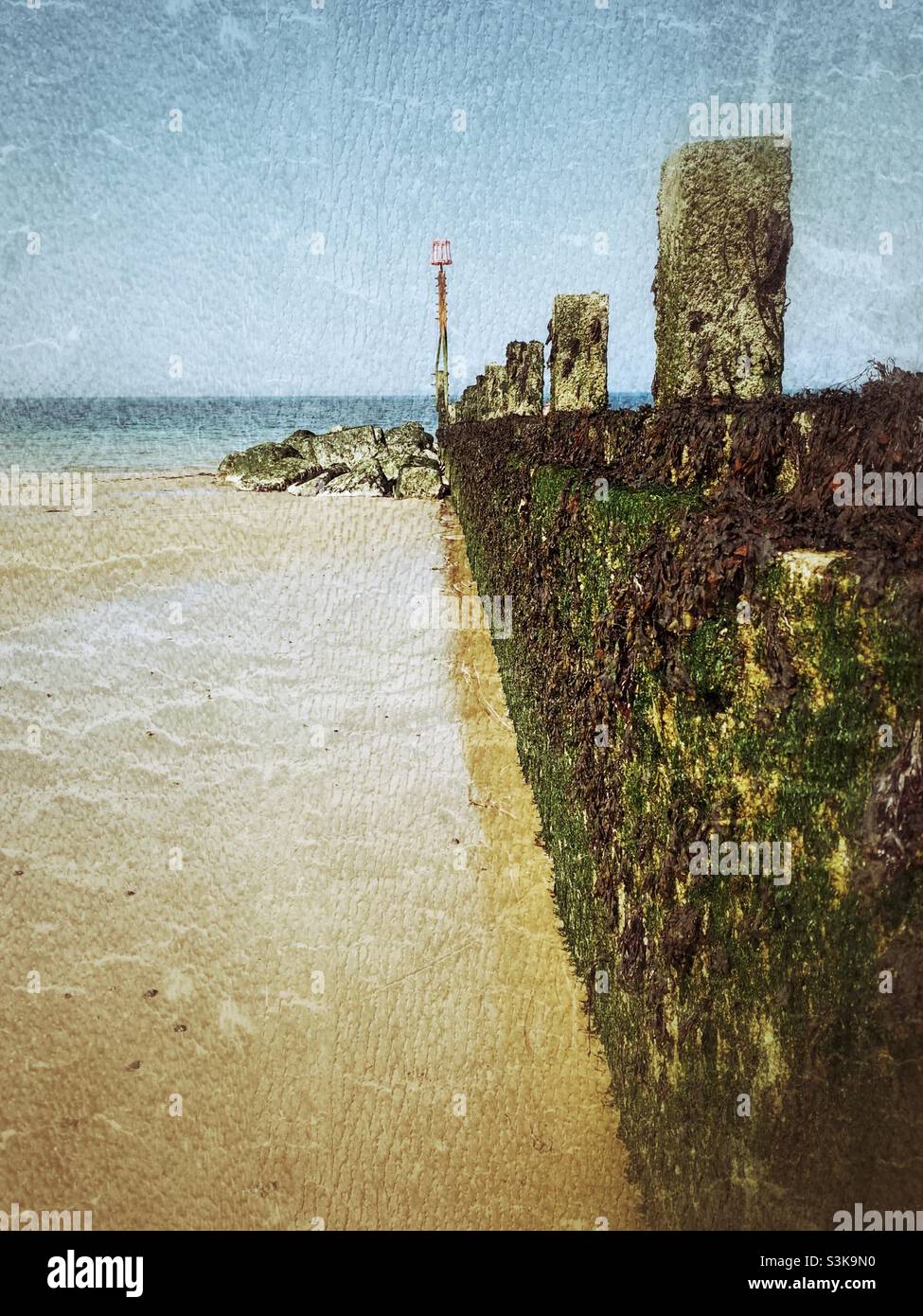 Grunge image of seaside breakwater groynes. Sheringham Norfolk UK Stock ...