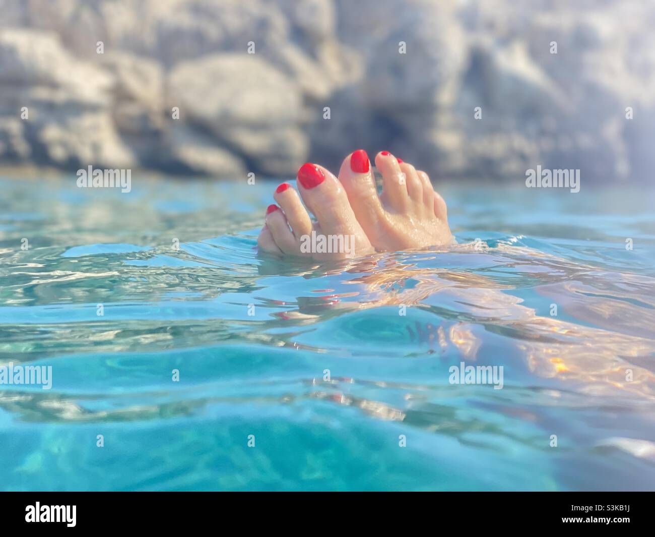 Feet in the sea Stock Photo - Alamy