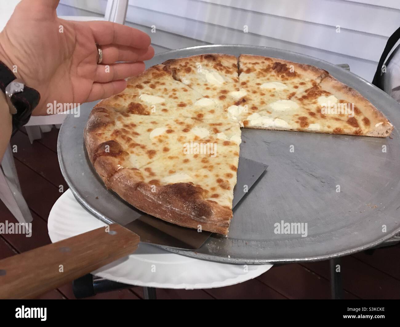 White pizza on plate in restaurant Stock Photo - Alamy