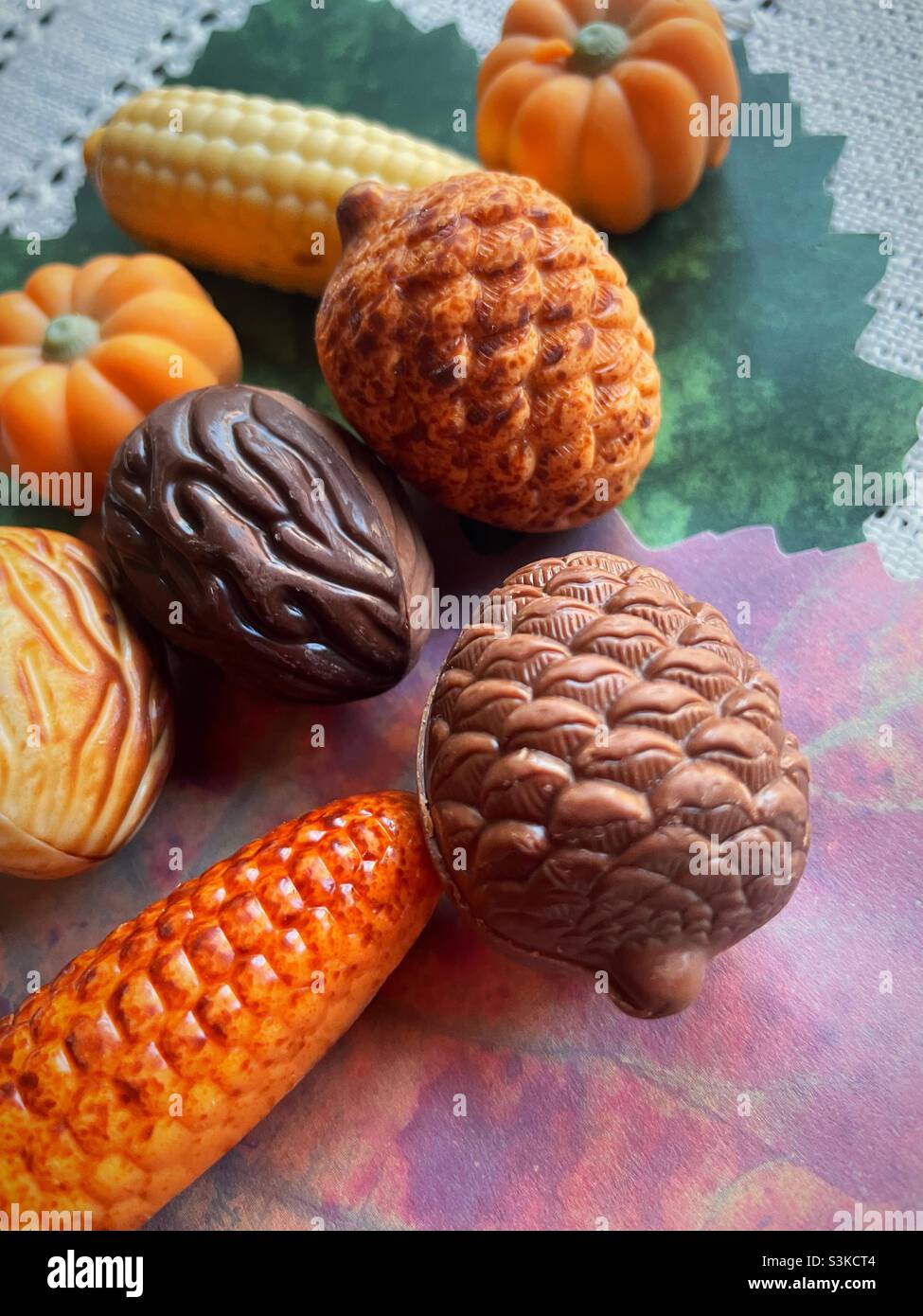 Close up of Belgian chocolate in the shape of vegetables and fruits as ...