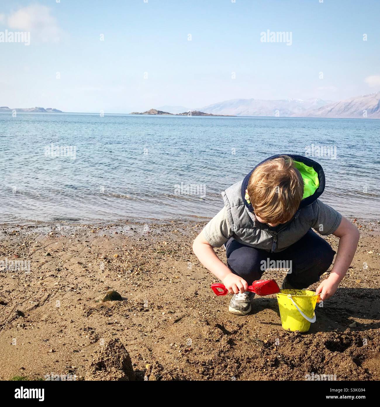 Child bucket spade hi-res stock photography and images - Alamy