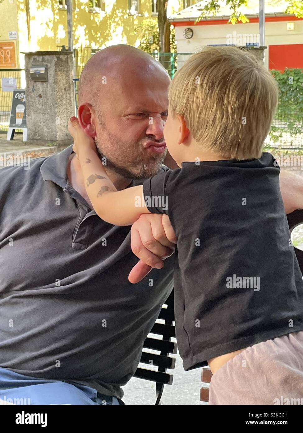 A father making funny faces for his toddler Stock Photo - Alamy