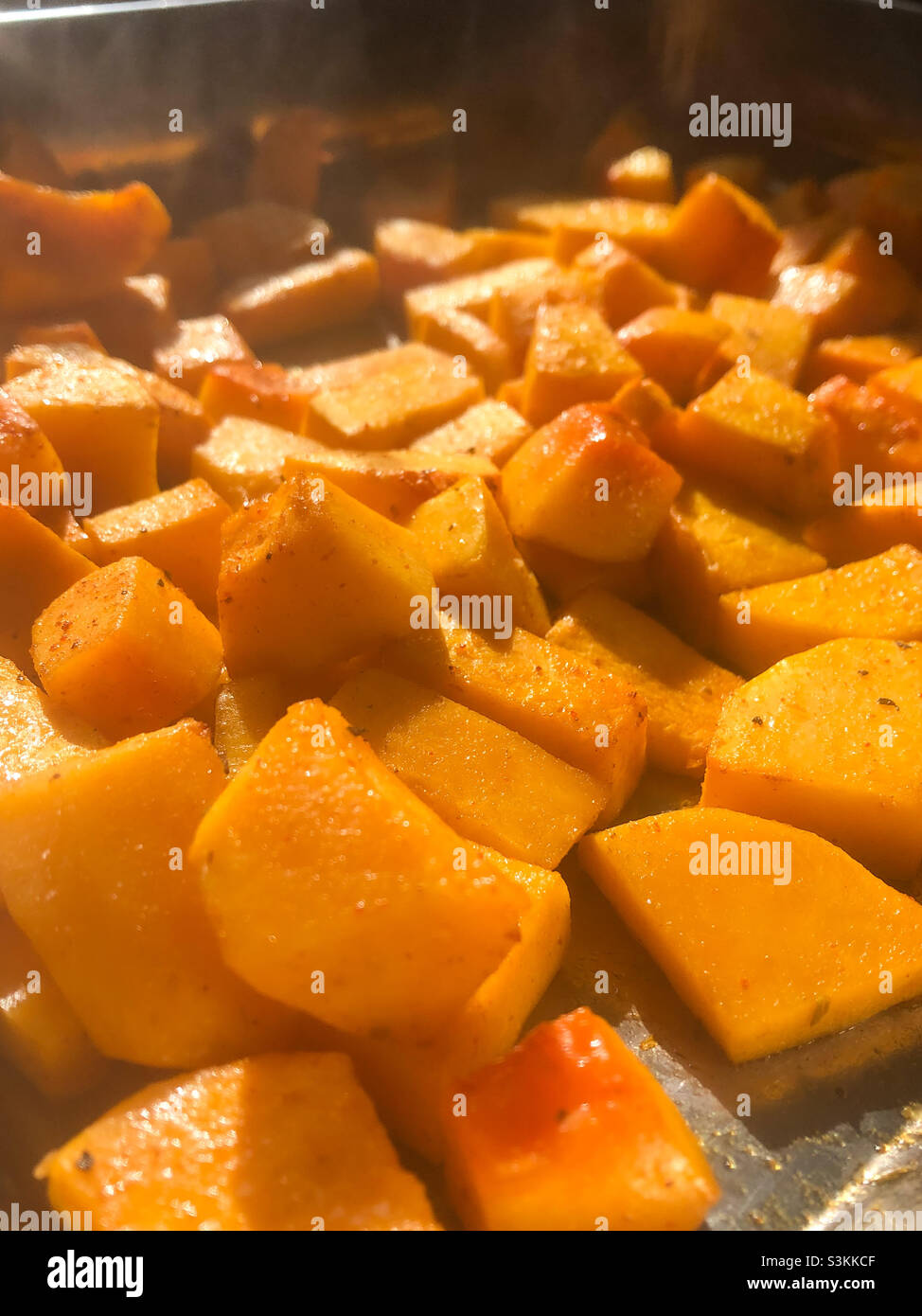 Chunks of roasting sweet potato Stock Photo - Alamy