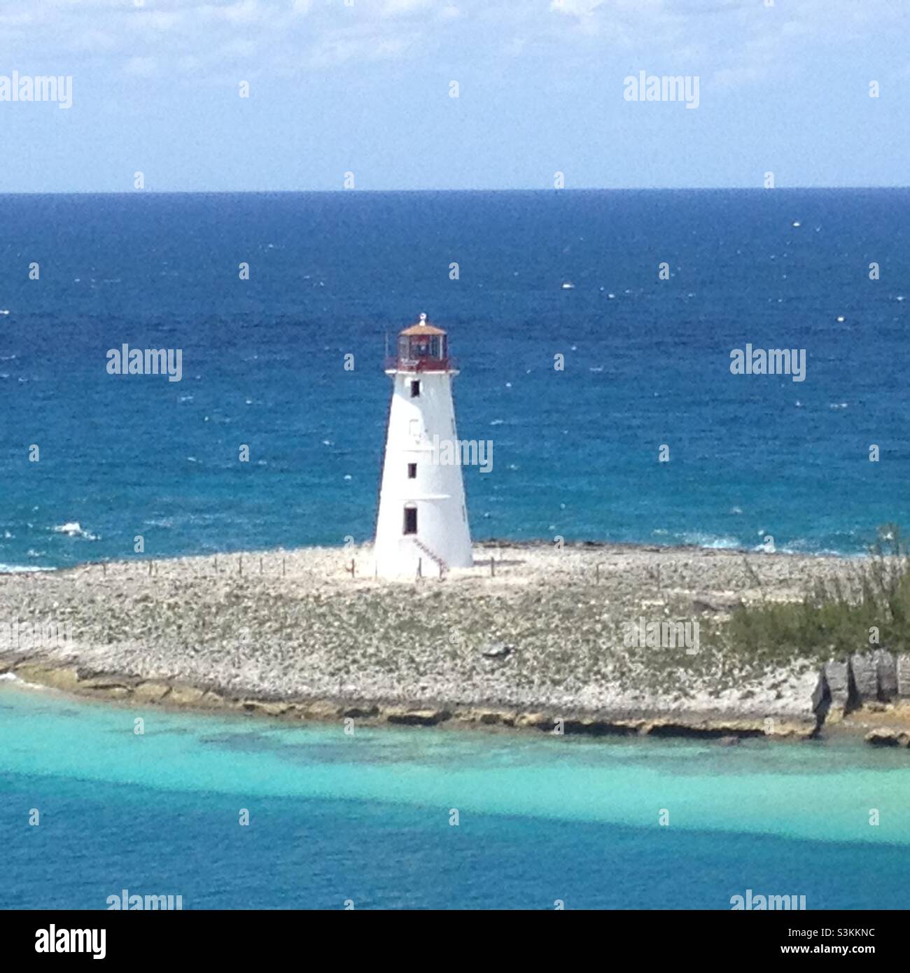 Lighthouse in the Caribbean set against the clear blue ocean Stock ...