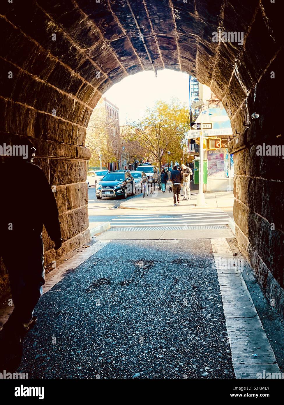 Walking through a sidewalk tunnel in New York City Stock Photo - Alamy