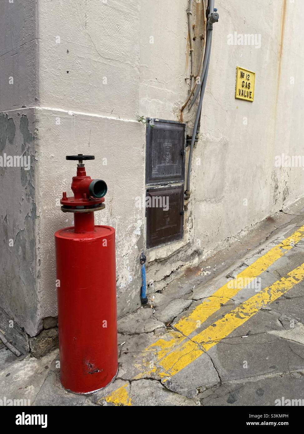 Fire hydrant on a street corner Stock Photo - Alamy