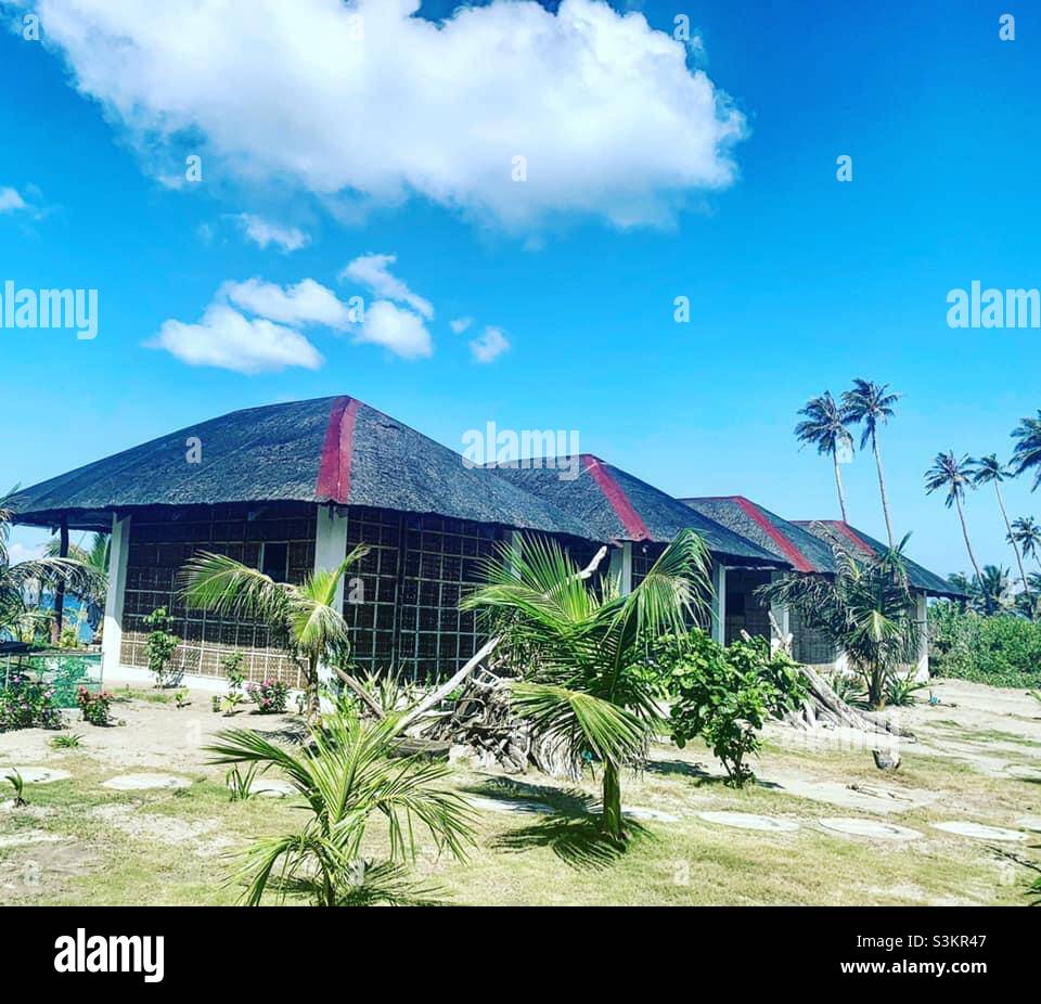 An array of villas made of indigenous materials. Beachfront! Stock ...
