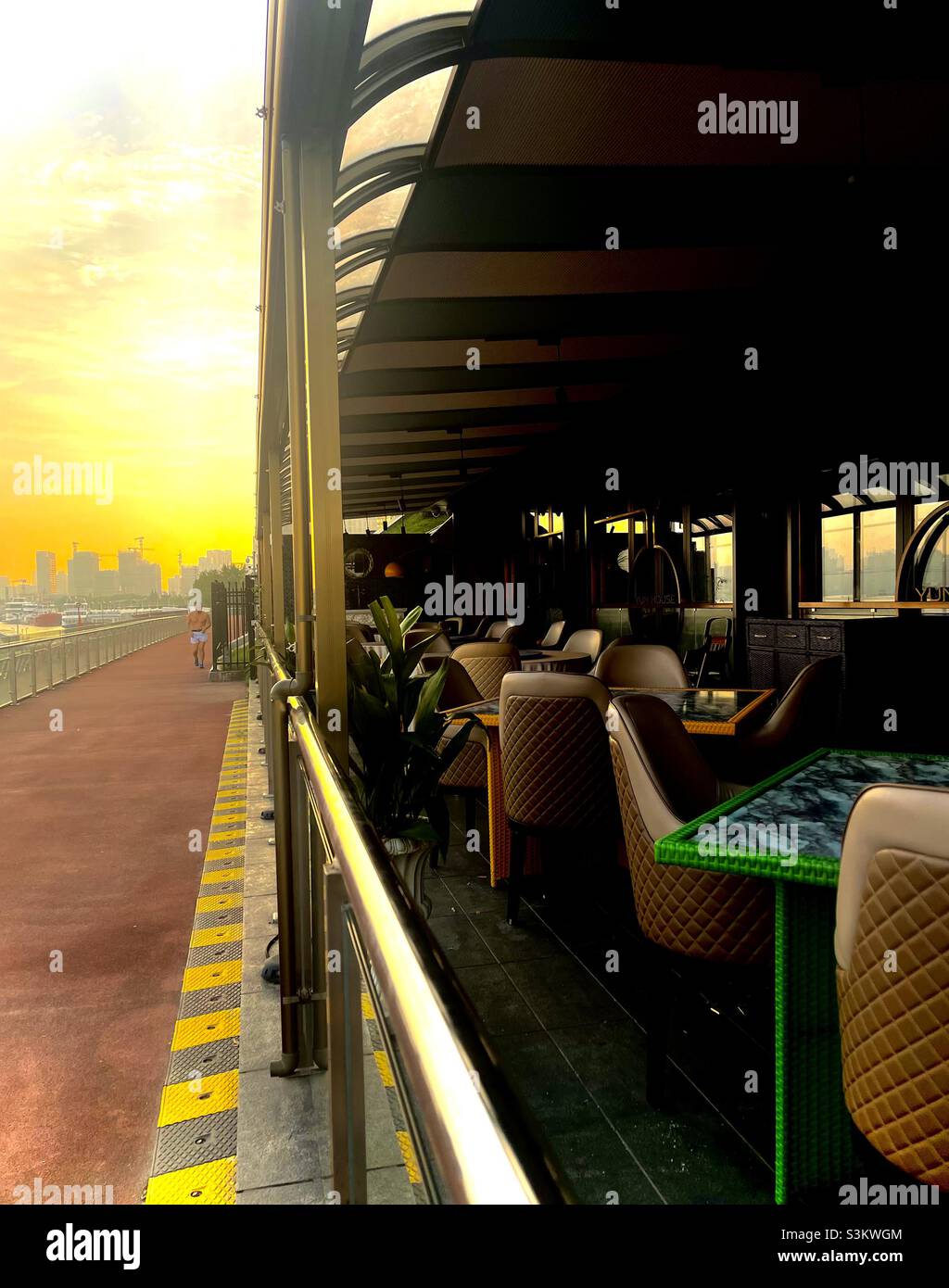 Restaurant & Runner In The Distance Stock Photo - Alamy