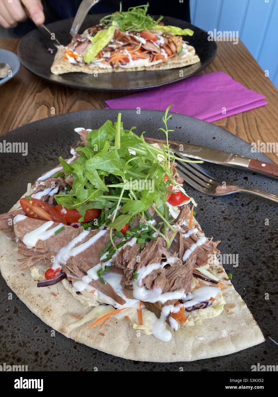 Flatbread with meats and salad for lunch Stock Photo - Alamy