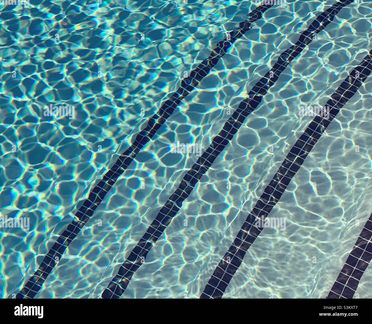 Sunlight on the surface of a resort pool Stock Photo - Alamy