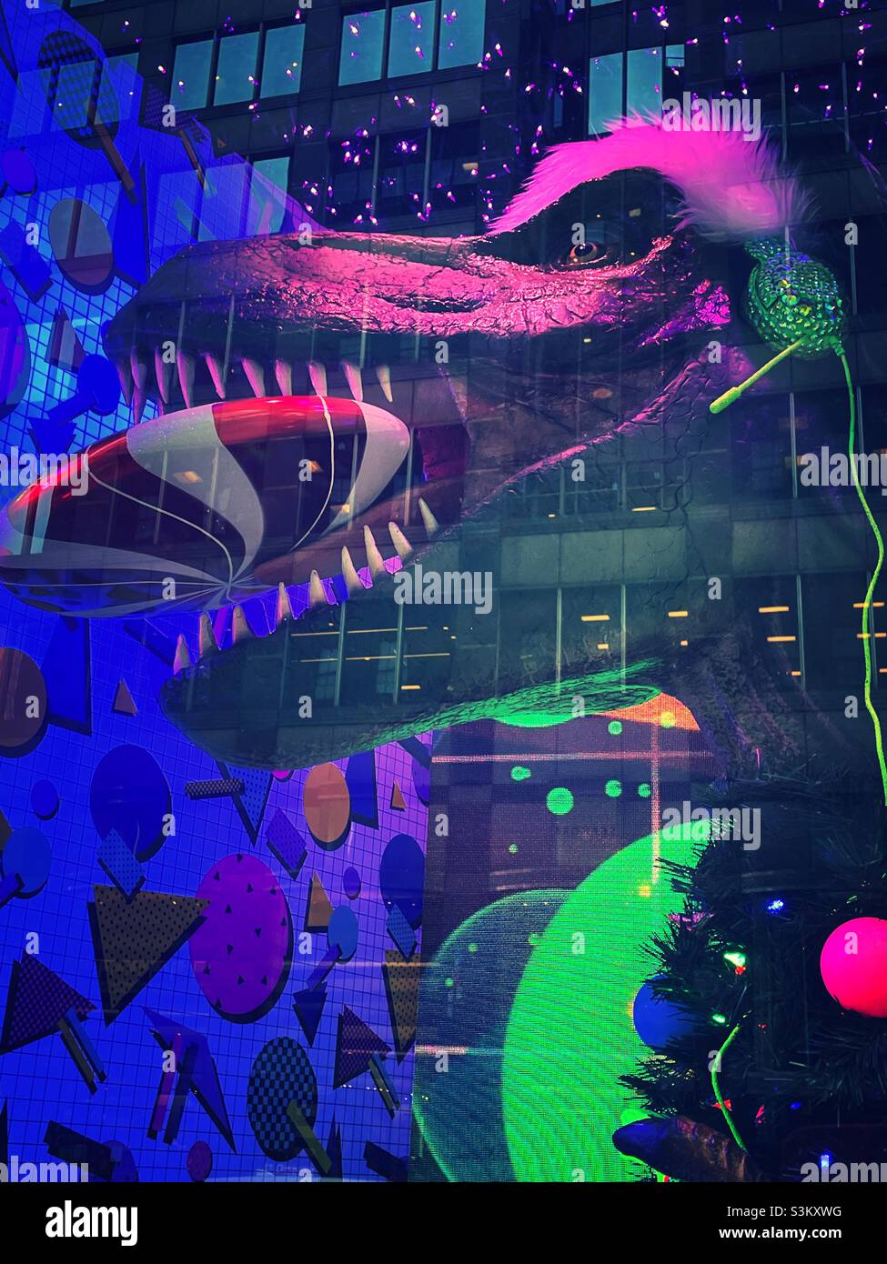 A stylized T Rex dinosaur in the holiday windows of the upscale ...