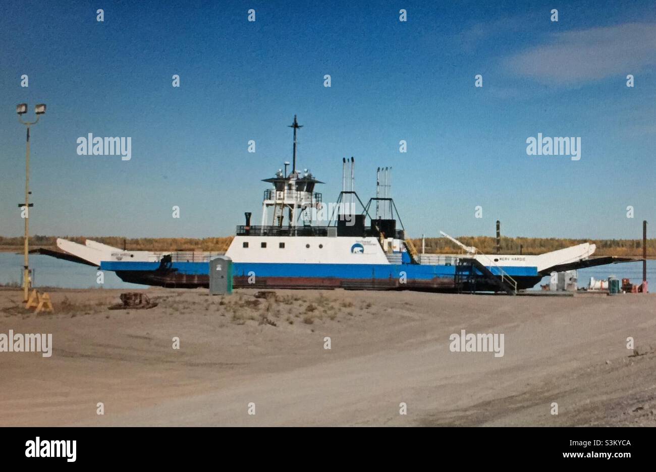 Retired ferry and the , The Deh Cho Bridge, cable-stayed bridge ...