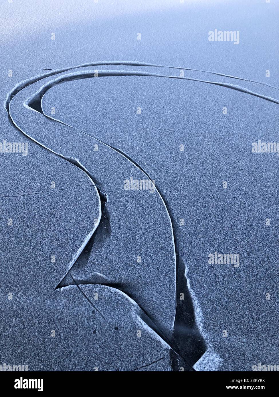 Ice skating tracks on natural ice Stock Photo - Alamy