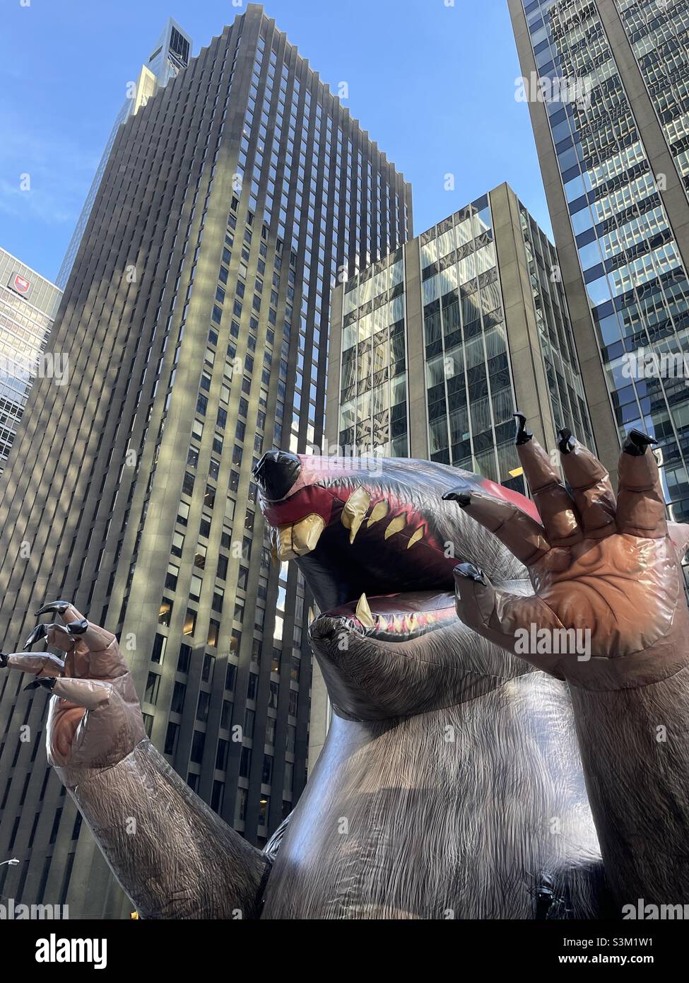 Giant inflatable rat in front of a union picket line in midtown ...